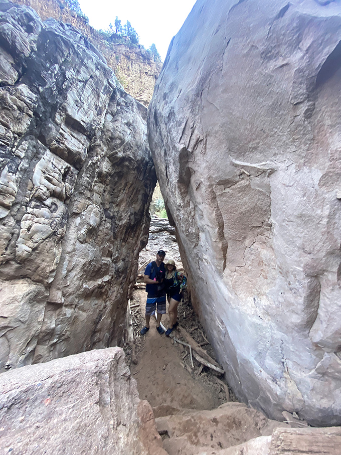Navigating the narrow passage between massive rock formations, nature's version of threading the needle on the way to paradise.