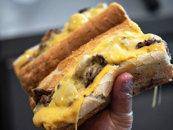 Melted cheese cascading over perfectly seasoned steak, because sometimes more is actually more.