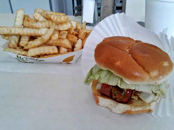 The classic combo: a perfectly crafted burger alongside golden, crispy fries, a pairing as timeless as Michigan summers and just as satisfying.