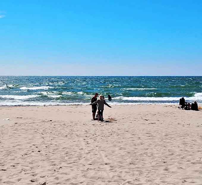 Beachcombers test the waters at Michigan's hidden coastal gem, where Lake Michigan reveals its Caribbean-worthy clarity.