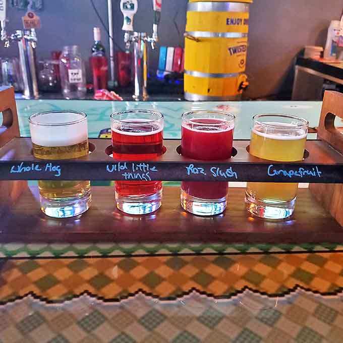 The beer flight presents liquid treasures in a wooden showcase, each glass offering a different adventure for your taste buds.