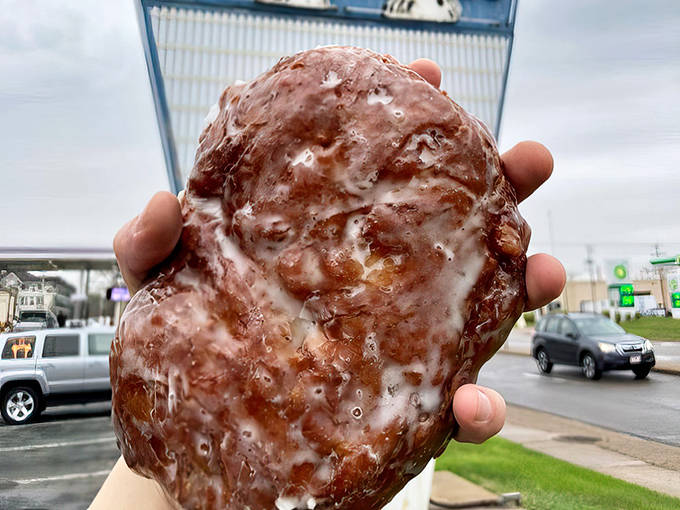 Behold the apple fritter in its natural habitat&mdash;massive, glistening, and practically daring you to eat it in one sitting.