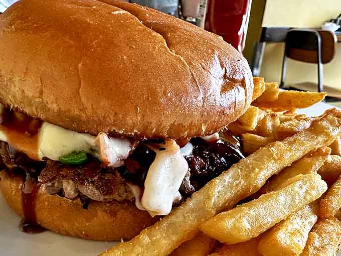 This isn't just a burger &ndash; it's a monument to beef perfection. The golden fries aren't sidekicks; they're co-stars in this delicious production.