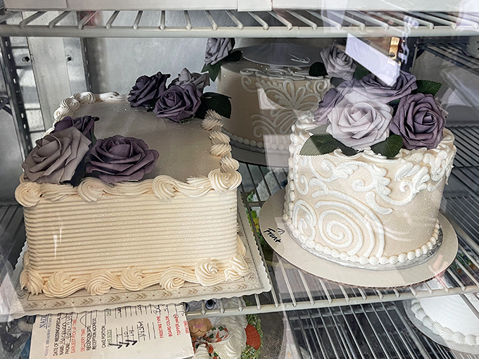 Wedding cakes that whisper elegance with their delicate purple roses and pristine white frosting &ndash; beauty that tastes as good as it looks.