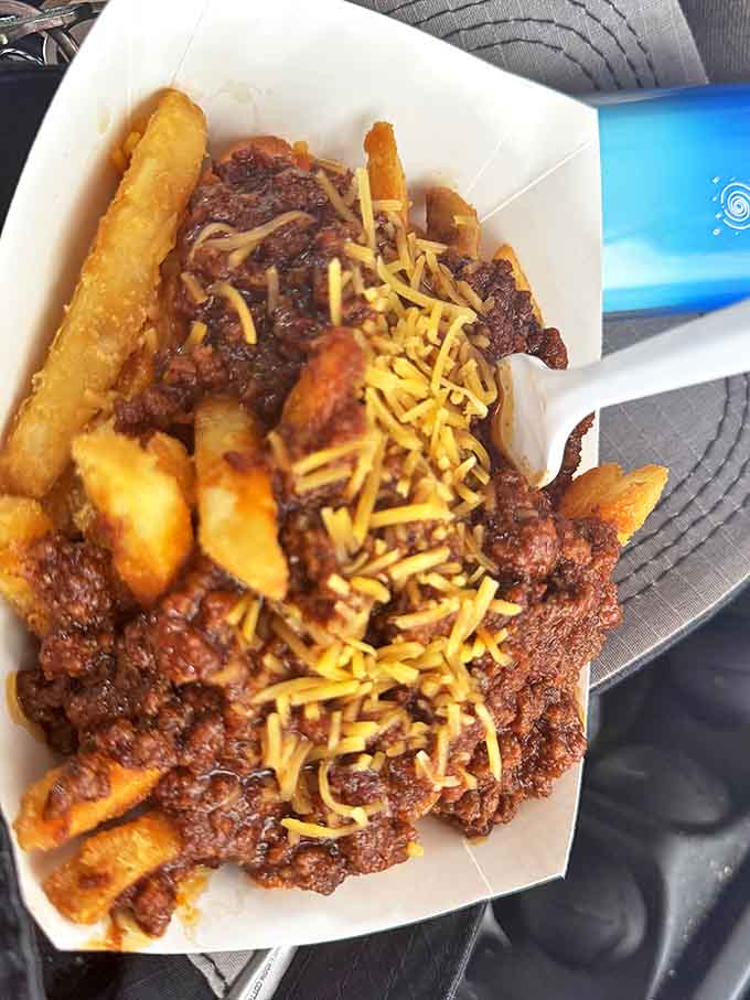 Golden fries swimming beneath a lava flow of hearty chili and melted cheese &ndash; comfort food that demands to be devoured.