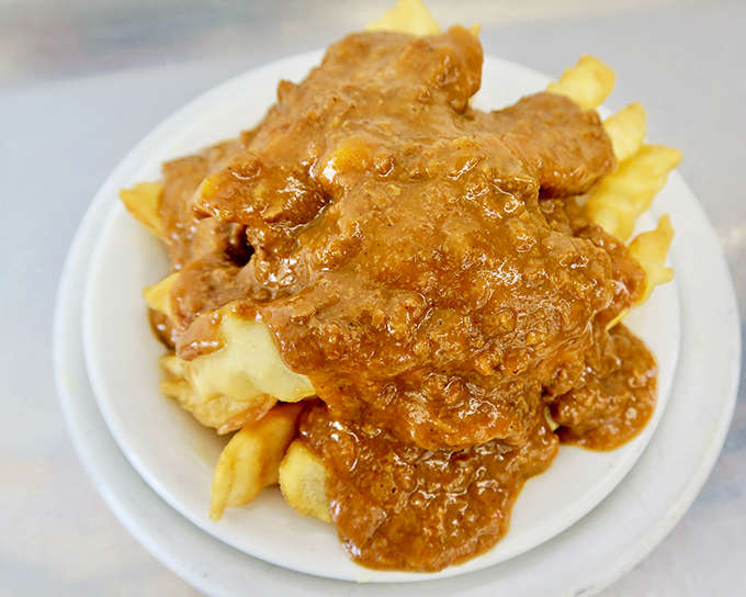 Chili fries that laugh in the face of utensils &ndash; a glorious mess that somehow maintains structural integrity until the last bite.