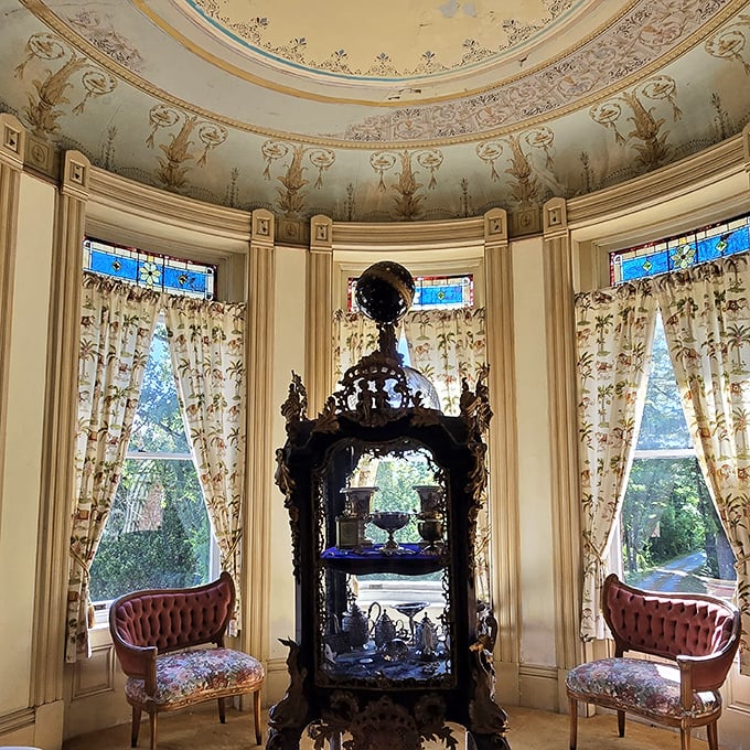 The castle's stunning rotunda features hand-painted ceilings and stained glass that transforms ordinary sunlight into kaleidoscopic magic.