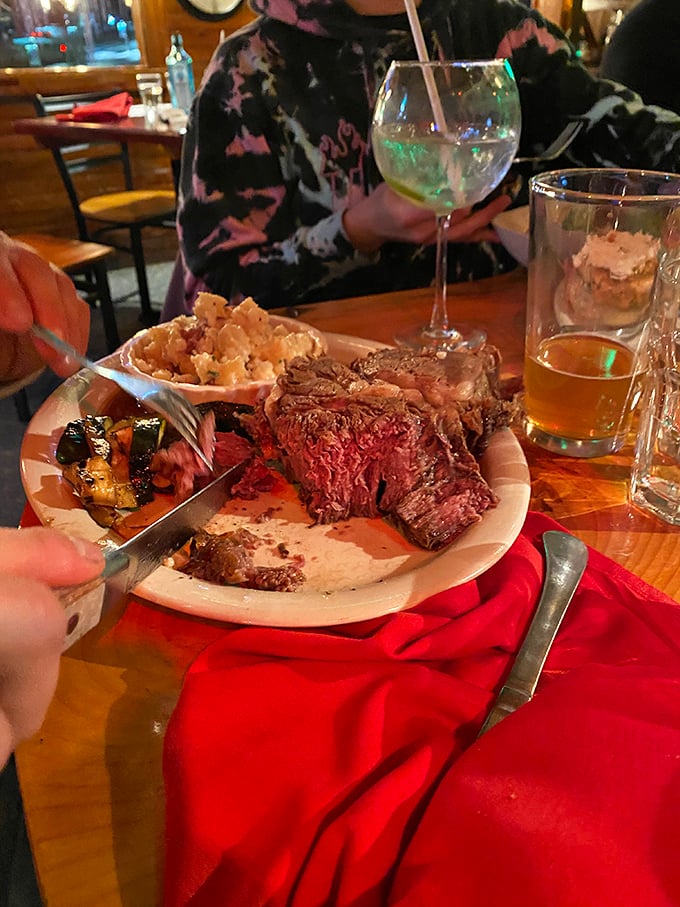 Cutting into this masterpiece feels almost ceremonial. The knife slides through like it's butter wearing a beef costume.