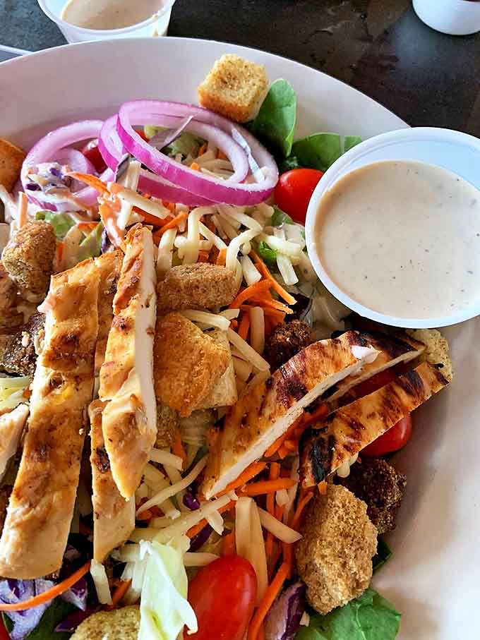 This vibrant chicken salad proves Crazy Horse isn't just about indulgence &ndash; fresh ingredients shine in lighter options too.