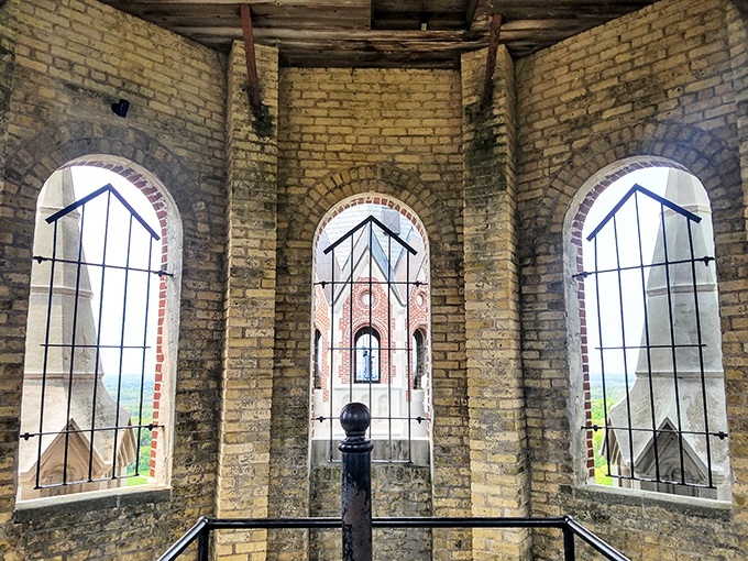 From the observation tower, visitors can peer through historic windows framing views that stretch for miles across Wisconsin's rolling countryside.