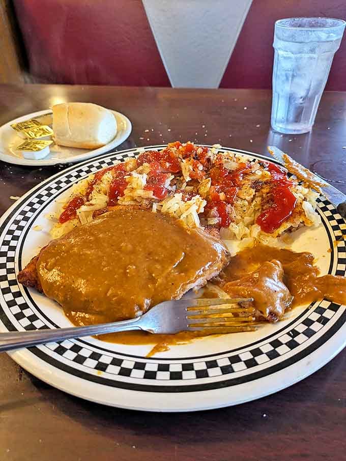 Comfort on a plate: tender meat smothered in rich gravy alongside hash browns so crispy they practically sing when your fork hits them.
