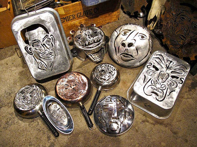 These metal faces hammered into serving trays and cookware prove that even your grandmother's kitchen items deserve a second act.