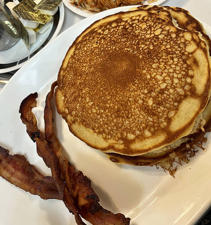 Pancakes & Bacon Crispy bacon playing the perfect supporting role to those cloud-like pancakes &ndash; a breakfast duet that sings on the taste buds.