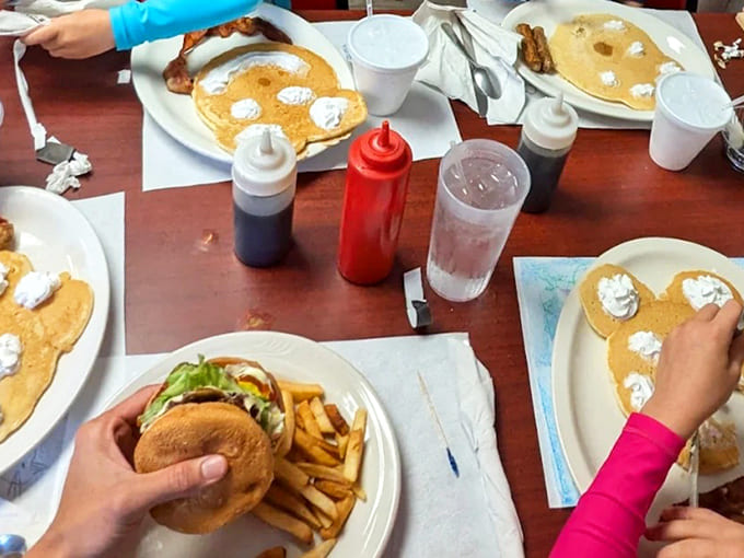 Pancake perfection meets burger bliss &ndash; a table spread that says "we came hungry and we're not leaving until we need a nap."