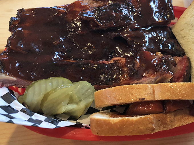 Glistening, sauce-lacquered ribs share the spotlight with a Hot Link Sandwich, creating a plate that's worth every napkin you'll need.