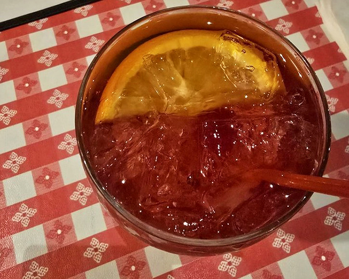 The sangria arrives like a sunset in a glass, fruit-infused and refreshing enough to make you forget you're in the desert.