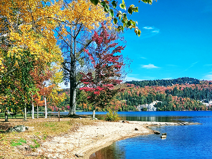 Autumn's canvas: Fall foliage creates a spectacular backdrop as Crystal Lake reflects nature's most vibrant season.