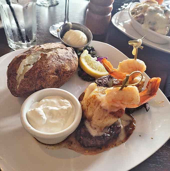 A juicy steak topped with jumbo shrimp and served with a baked potato &ndash; comfort food elevated to art form.