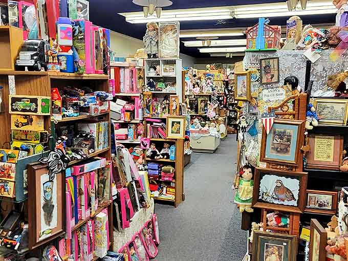 The sidewalk display offers garden treasures and outdoor collectibles, with vintage wagons and weathered toys creating an inviting preview of wonders within.