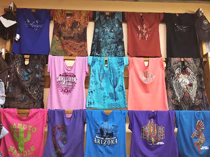 T-shirts in every shade of the rainbow celebrate Arizona's spirit, from saguaro-studded designs to clever sayings that capture the state's unique personality perfectly.