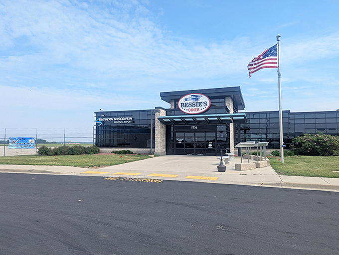 With its clean lines and American flag flying proudly, Bessie's Diner combines patriotic charm with aviation-themed dining.