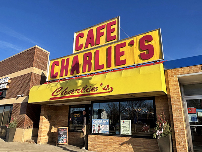 The bold yellow awning and distinctive signage of Charlie's Cafe make it an unmistakable landmark in small-town Freeport.
