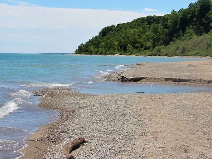 The freshly groomed sand at Grant Park Beach awaits early morning visitors, with blue Adirondack chairs providing front-row seats to nature's show.