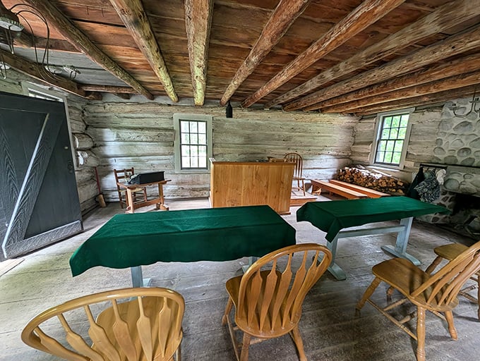 Inside the 1820s schoolhouse, simple wooden furnishings remind us that education once required only slates, discipline, and surprisingly uncomfortable chairs.