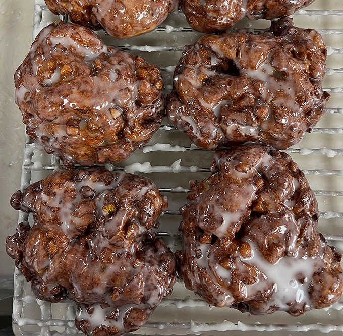 These apple fritters aren't just donuts—they're architectural marvels of caramelized, cinnamon-spiced perfection. Crispy edges, tender centers, pure bliss.