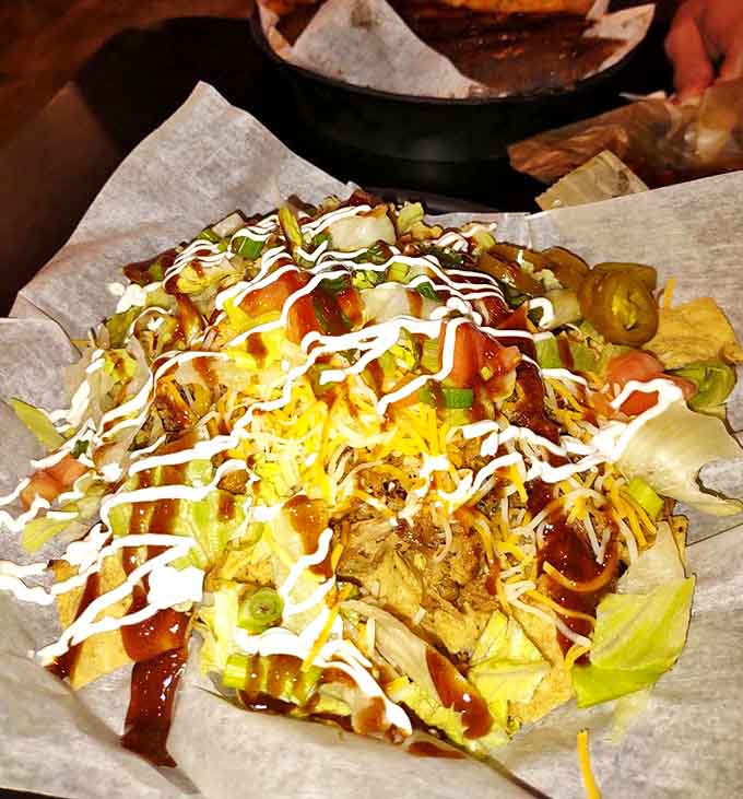 Loaded nachos that transform a simple appetizer into a full-blown barbecue experience, every chip carrying its weight in toppings and flavor.