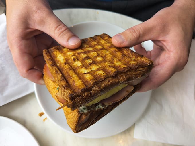 When your breakfast sandwich is built on croissant loaf, you're basically winning at life before 9 AM even hits.