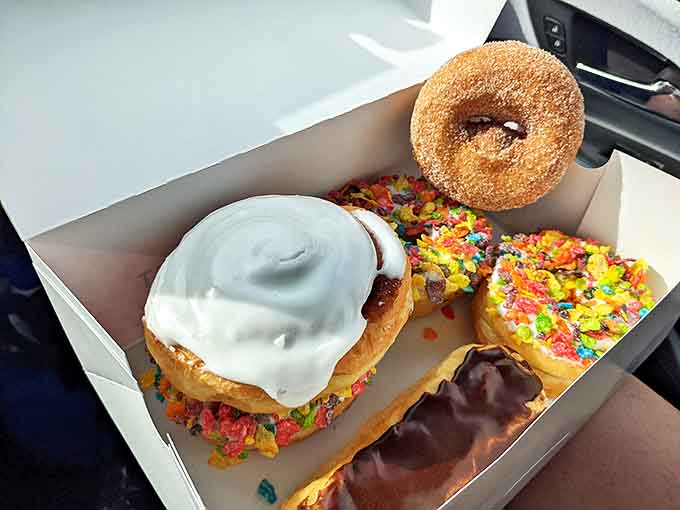 A white box of possibilities &ndash; chocolate, glazed, sprinkled, and sugared &ndash; the breakfast equivalent of a royal flush.