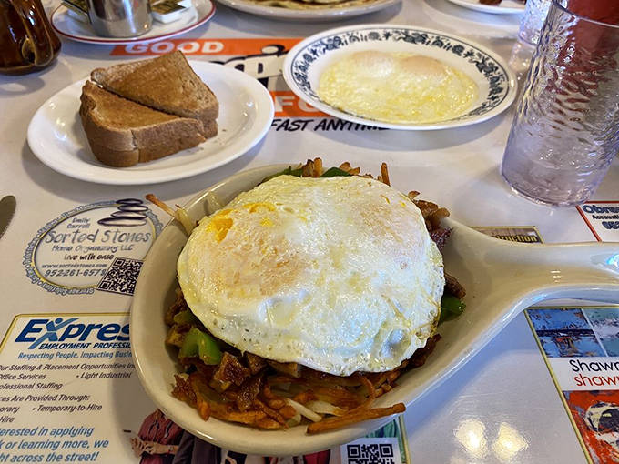 A mountain of breakfast goodness topped with a perfectly fried egg &ndash; the kind of morning fuel that makes Monday feel conquerable.