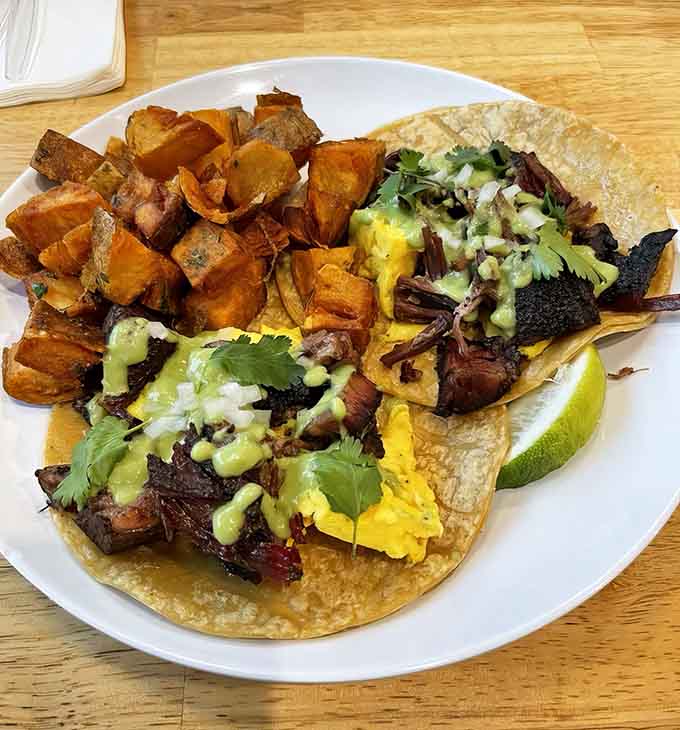 Breakfast tacos stuffed with brisket and topped with fresh ingredients prove that morning meals should never be boring or meatless.