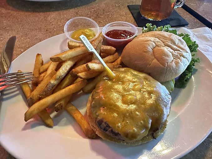 A burger that requires both hands and possibly a strategy session before attempting to eat it &ndash; cheese melting like a golden sunset.
