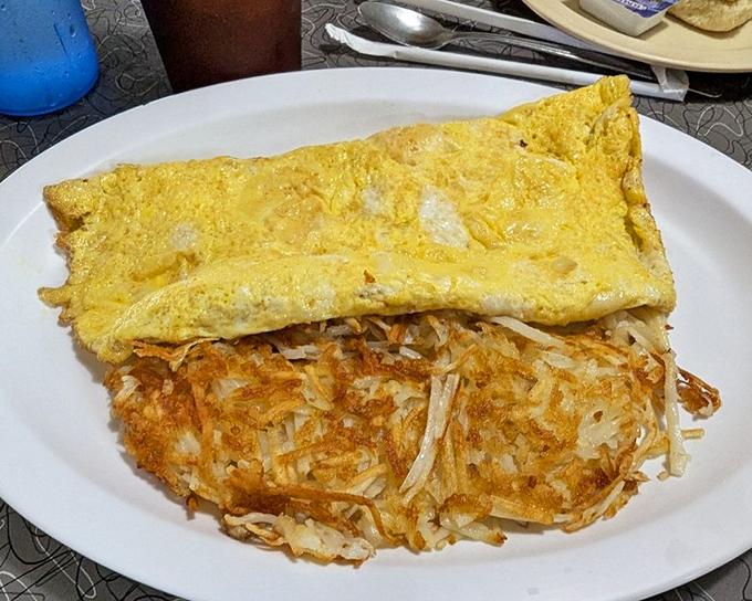 This cheese omelet doesn't need fancy ingredients to impress – just perfectly executed simplicity and a side of crispy hash browns.