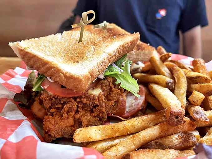 The Chicken Club stacks fried chicken, bacon, and fresh veggies on Texas toast&mdash;a towering achievement that requires both hands and zero shame.