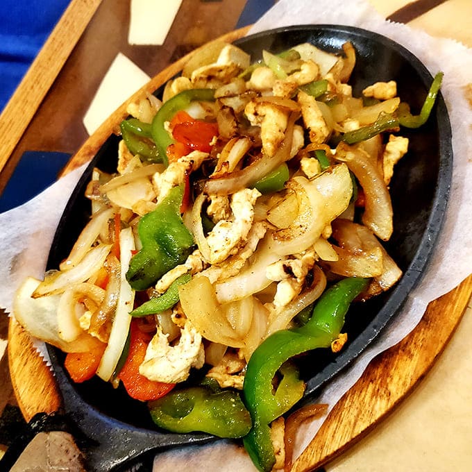 These sizzling chicken fajitas don't just arrive at your table &ndash; they make an entrance, with steam rising from a hot skillet of perfectly seasoned goodness.