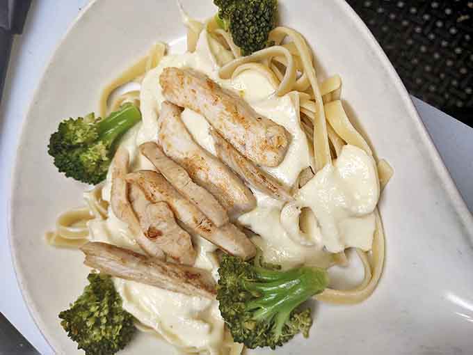 Creamy Alfredo sauce coats every strand of fettuccine while broccoli adds color and textural contrast to this comforting classic.