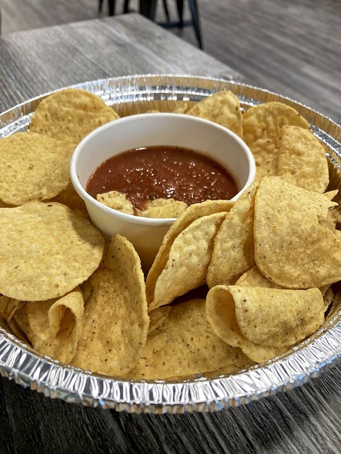 These aren't your average tortilla chips! House-made corn crisps surround a bowl of fresh salsa that'll ruin store-bought versions for you forever.