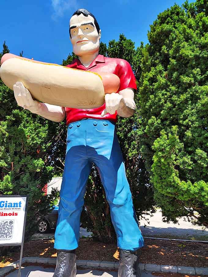 That face! Part friendly neighborhood grocer, part mischievous trickster – he knows that hot dog is ridiculously oversized and he's loving it.