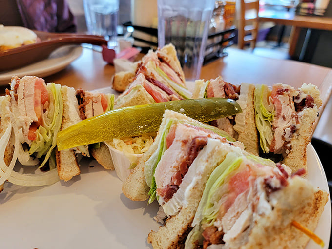 Club Sandwich: Architectural marvel of turkey, bacon, lettuce and tomato held together by industrial-strength toothpicks and sheer determination.