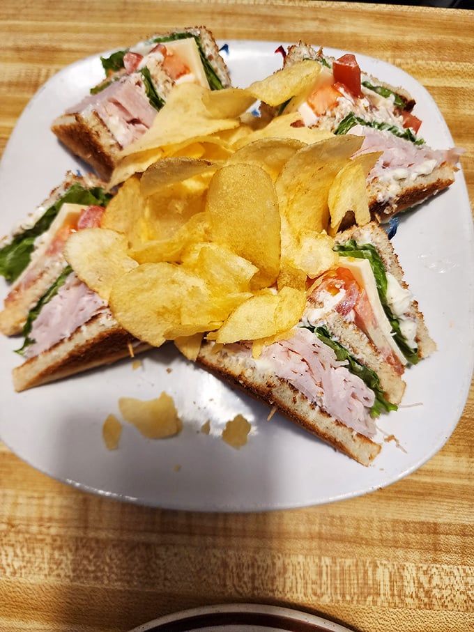 The club sandwich &ndash; an architectural marvel of turkey, ham, and bacon, surrounded by chips that crunch with homemade perfection.