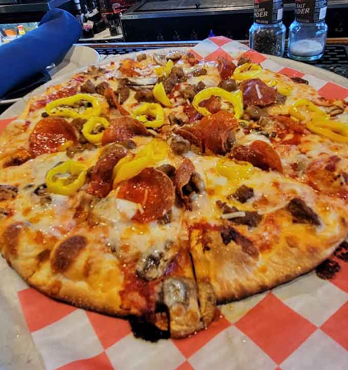 Pizza topped with peppers and sausage proves that good things come in crispy, cheesy circles of joy.