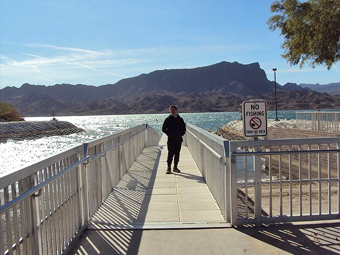 The park's walking bridge extends like an invitation to adventure, connecting visitors to both shores and possibilities.