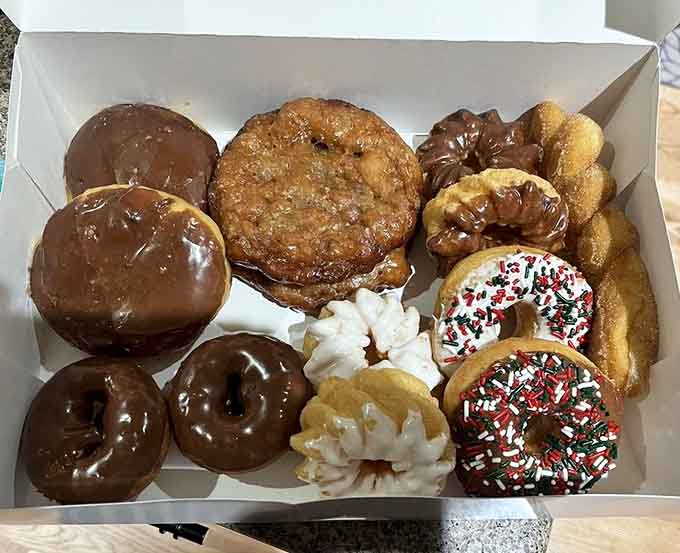 When bismarcks meet apple fritters, it's like the Avengers of the pastry world assembling in one glorious box.