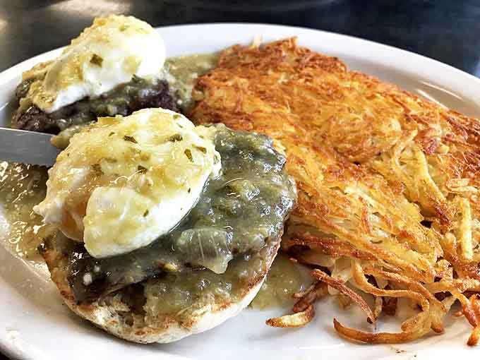 Egg Benedict with Green Sauce: Southwestern heat meets breakfast elegance &ndash; where green chile sauce transforms the classic Benedict into something boldly different.