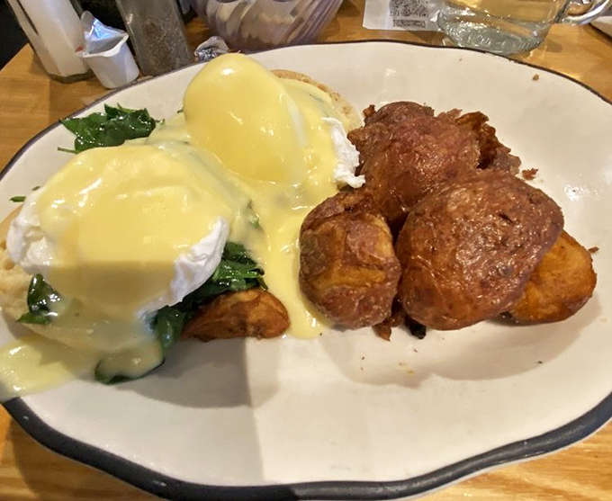 That hollandaise cascade over perfectly poached eggs is the kind of sight that makes breakfast lovers weak in the knees.