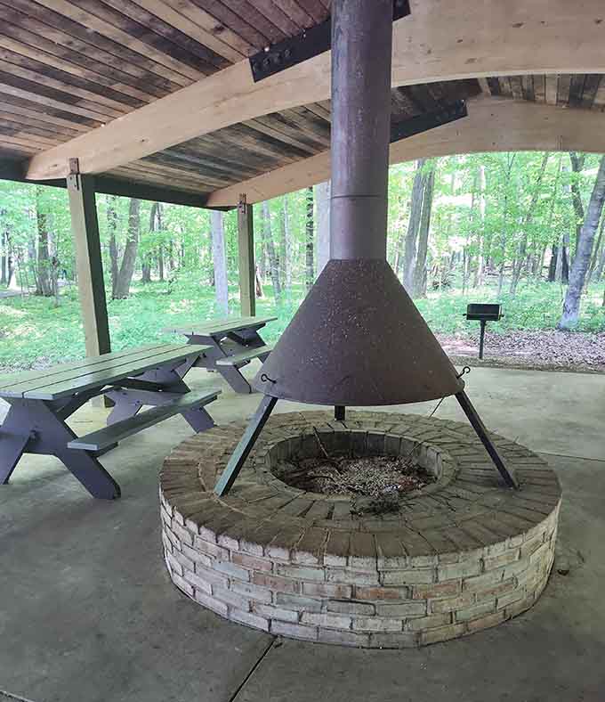 This covered fire pit area proves that gathering around flames is humanity's oldest form of entertainment and still one of the best.