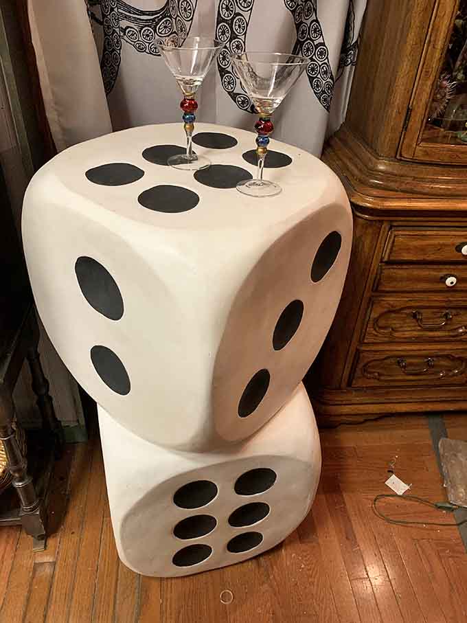 Giant dice serving as a side table prove that furniture can be functional, whimsical, and a conversation starter all at once.